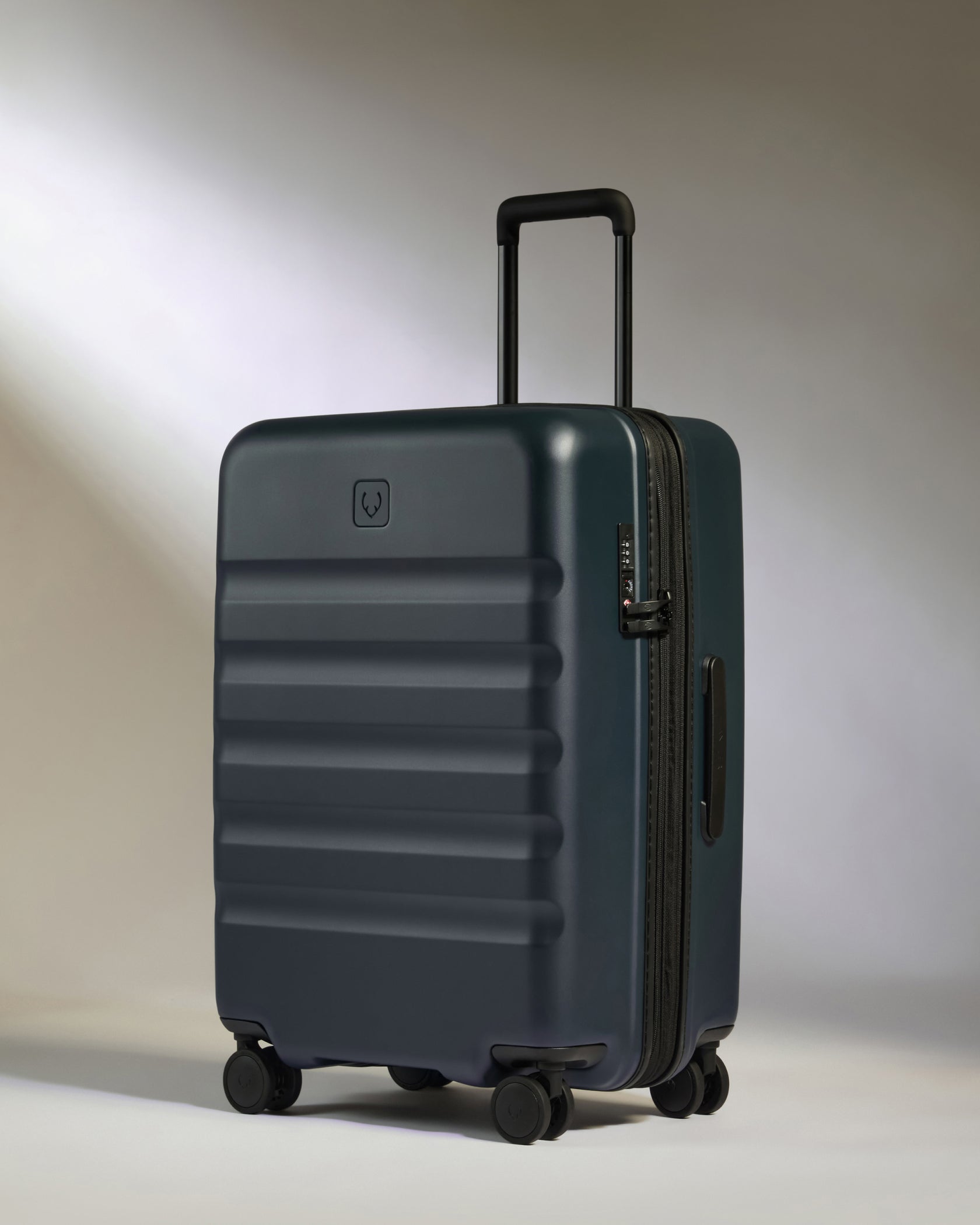 Medium Suitcase in Navy Blue - Icon Stripe | Lightweight & Hard Shell ...